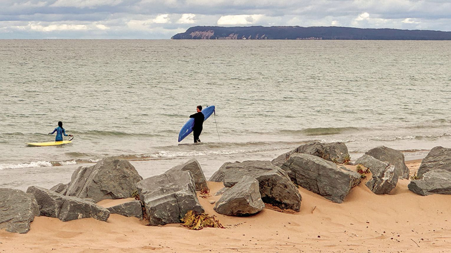 Surf boarders donned wet suits before heading out on Lake Michigan
